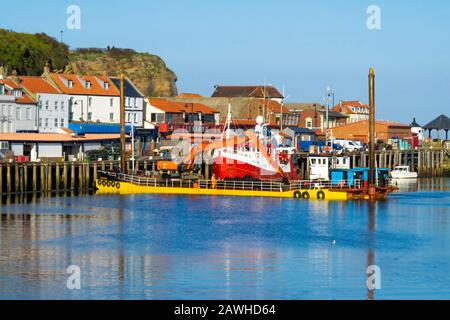 Excavation port maintenance dredger Sandsend passed trough Whitby ...