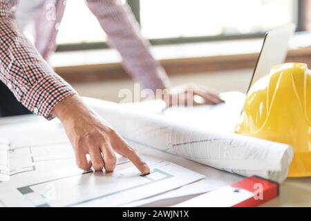architect engineer working on house blueprint of real estate project at ...