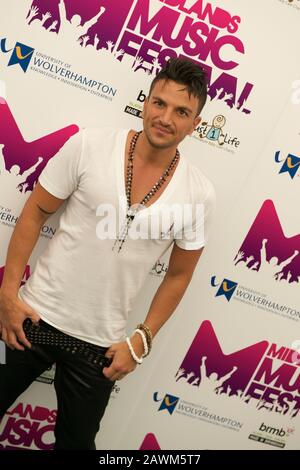 Pop singer Peter Andre poses with a CD of his latest single 'Defender ...