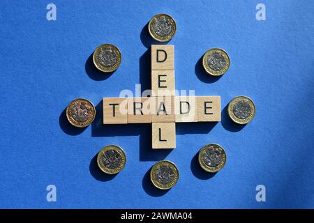 Trade Deal in 3d wooden alphabet letters on a blue background Stock ...