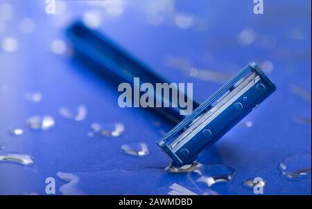 Close up view of metallic razor blade isolated on black background ...