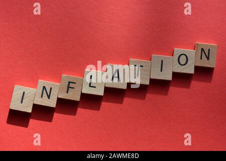 Inflation in 3D wooden alphabet letters on a red background with ...