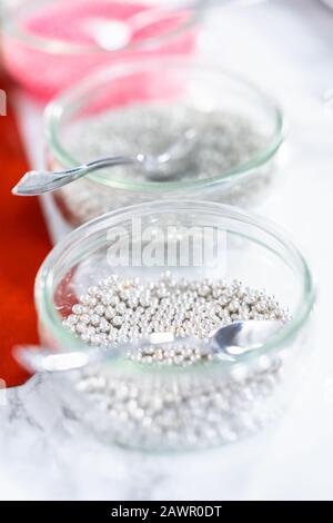 Candy sprinkles in small glass containers with spoons Stock Photo - Alamy