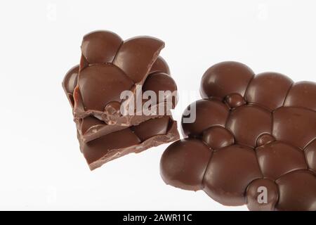 milk chocolate bar, chocolate popping (popcik) isolated on white ...