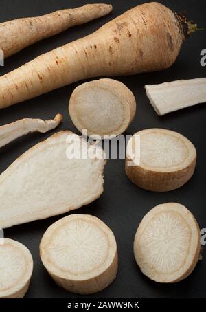 Parsnip root slice isolated on white background closeup. Top view. Flat ...