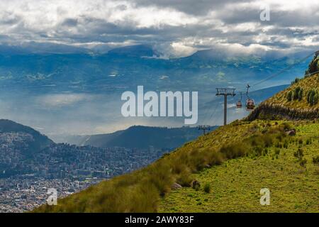 Quito cityscape with its cable car called Teleferico seen from the ...
