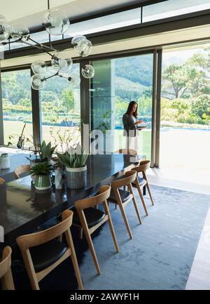 smart phone with smart home with modern dining room Stock Photo - Alamy