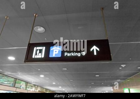 Parking level sign with blue P sign and baggage label at airport Stock ...