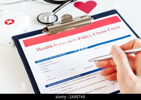 Blank health insurance policy claim form with stethoscope on clipboard ...