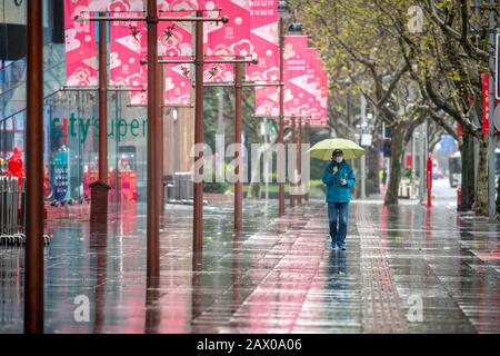 People wear face masks to protect against the spread of the coronavirus ...