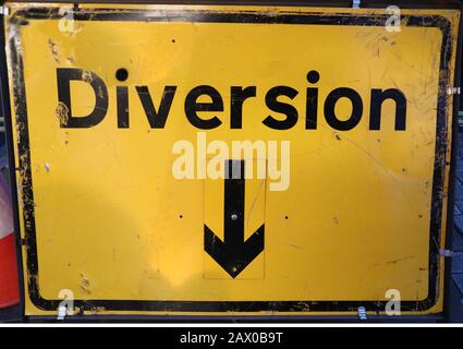 Keep left and left turn only sign in the middle of a busy street at ...