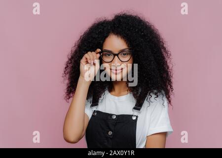 Photo of pretty millennial curly hairdo lady hold placard wear colorful ...