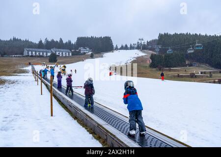Conveyor belt ski lift, beginners ski area Ritzhagen, operated with ...