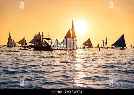 Paraw sailing at Boracay Island, Philippines at Sunset Stock Photo - Alamy