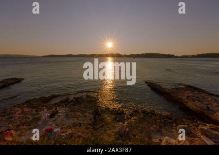 beach at sunset vouliagmeni athens riviera athens greece Stock Photo ...