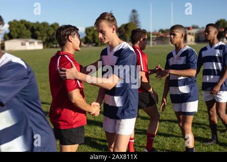 Rugby players shaking hands Stock Photo - Alamy