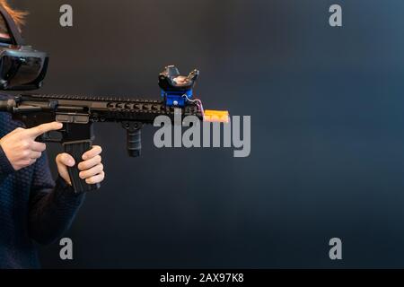 wearing VR goggles playing virtual reality shooter game Stock Photo - Alamy