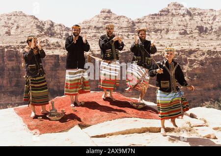 A group of Saudi Arabs performing traditional saudi arabian dance in ...