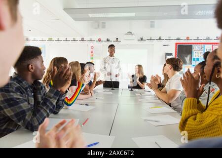 High school students clapping for classmate in debate class Stock Photo ...