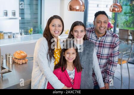 Happy family in the kitchen Stock Photo - Alamy