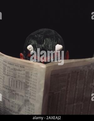Man with devil mask reading a newspaper, Germany Stock Photo - Alamy