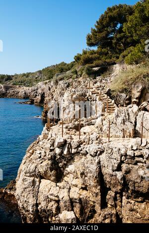 Antibes hike in the Cap d'Antibes bay with coastal cliffs, French ...