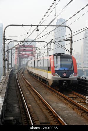 Shanghai metro line 3 train approaches Baoshan road station, Shanghai ...