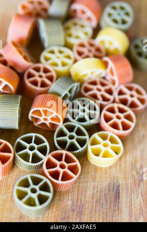 Closeup shot of a wheel-shaped yellow outdoor exercise equipment at a ...
