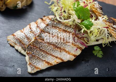 Fine Dining Fish dish on slate Stock Photo - Alamy