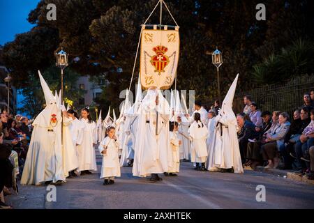 Penitent in traditional hood and robe in an Easter parade on Holy ...