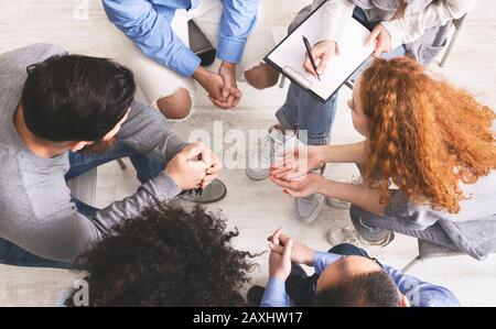 Group of business people discussing business problems at meeting table ...