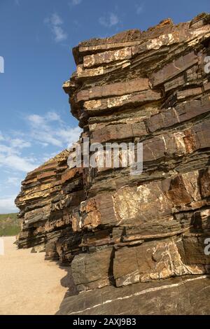 Tilted layers showing bedding planes strata of sedimentary rock coastal ...