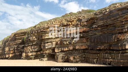 Tilted layers showing bedding planes strata of sedimentary rock coastal ...