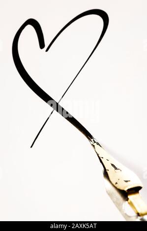 Heart and Pen on Valentine's Day in a diary Stock Photo - Alamy