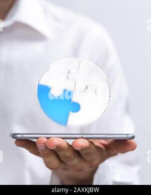 Person presenting a virtual projection of puzzles - business solution ...