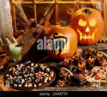 Halloween holiday cookies on wooden background Stock Photo - Alamy