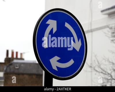 Mini Roundabout road sign. A British highway code sign, a round circle ...