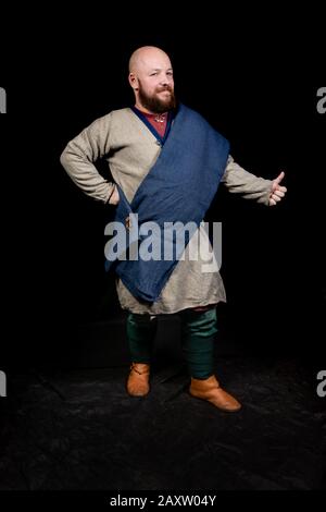 Overweight bearded man in the image of a medieval merchant Stock Photo ...