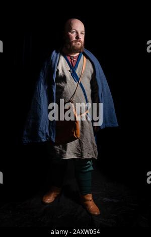 Overweight bearded man in the image of a medieval merchant Stock Photo ...