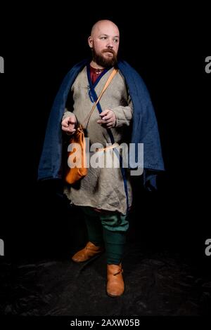 Overweight bearded man in the image of a medieval merchant Stock Photo ...
