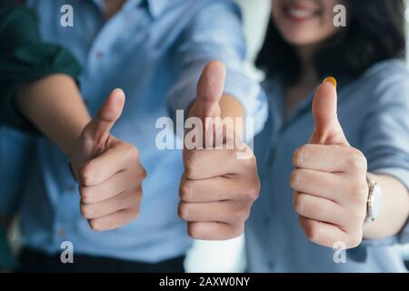 Group of people show OK or confirm with thumb up Stock Photo - Alamy