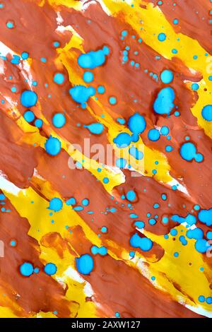 Abstract ink blue, green and yellow watercolor ink drops background ...