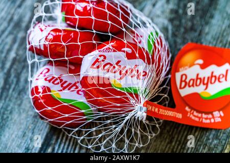 Babybel cheese in red wax cover with wedge sliced off Stock Photo - Alamy