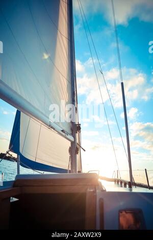 Luxurious yacht sailing on beautiful sea against clear blue sky during ...