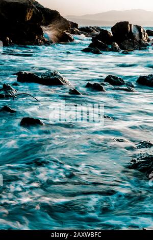 Long Exposure Of Sea Wave with rock Stock Photo - Alamy