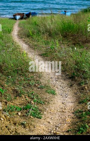 Path leading to two boats Stock Photo - Alamy