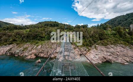 Buller Gorge Swing Bridge over Buller river, West Coast, South Island ...