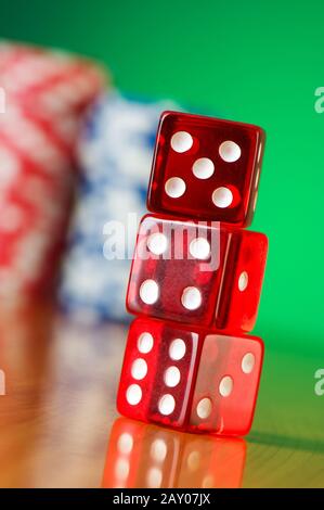 Stack of red casino dice against gradient background Stock Photo - Alamy