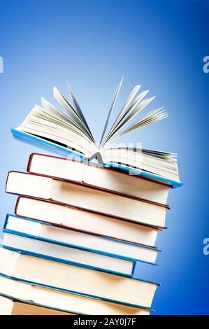 Stack of books against gradient background Stock Photo - Alamy