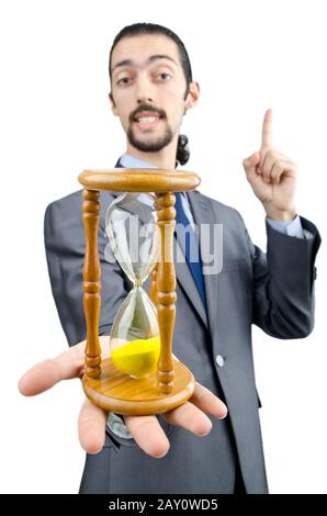 Happy businessman holding hourglass on black background. Time ...